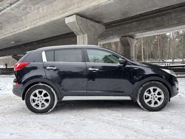 Black Kia Sportage 2013 in Riga, with an engine capacity of 2.00 L and mileage of 0 thousand km for 6990 €, photo 6 on AUTOMOTO.COM.LV