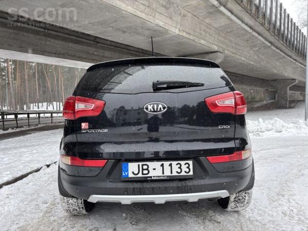 Black Kia Sportage 2013 in Riga, with an engine capacity of 2.00 L and mileage of 0 thousand km for 6990 €, photo 8 on AUTOMOTO.COM.LV