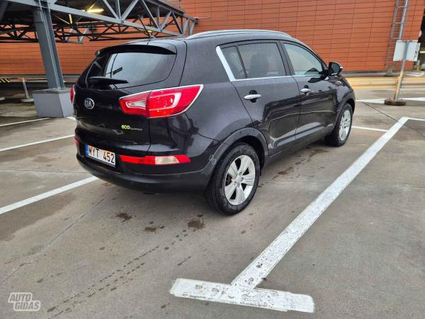 Black Kia Sportage 2013 in Siauliai, with an engine capacity of 1.70 L and mileage of 208 thousand km for 6900 €, photo 7 on AUTOMOTO.COM.LV