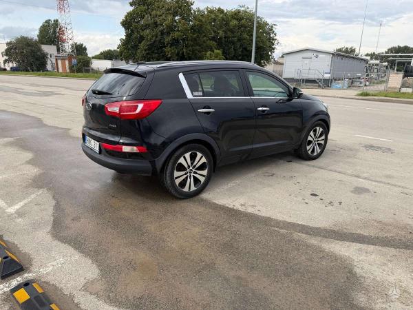 Black Kia Sportage 2013 in Marijampole, with an engine capacity of 2.00 L and mileage of 140 thousand km for 7900 €, photo 3 on AUTOMOTO.COM.LV