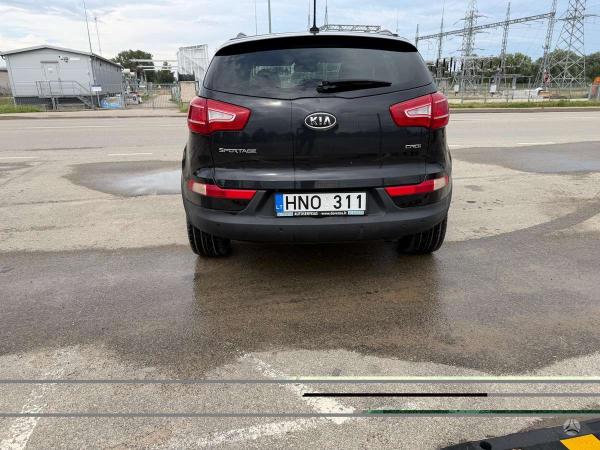 Black Kia Sportage 2013 in Marijampole, with an engine capacity of 2.00 L and mileage of 140 thousand km for 7900 €, photo 7 on AUTOMOTO.COM.LV