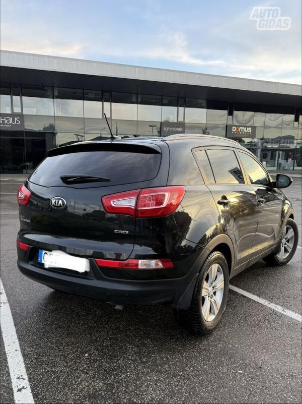 Black Kia Sportage 2013 in Vilnius, with an engine capacity of 2.00 L and mileage of 262 thousand km for 5950 €, photo 4 on AUTOMOTO.COM.LV