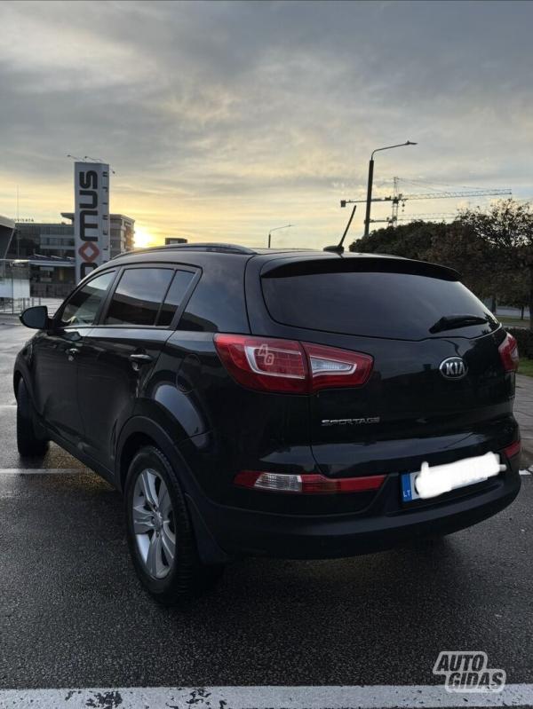 Black Kia Sportage 2013 in Vilnius, with an engine capacity of 2.00 L and mileage of 262 thousand km for 5950 €, photo 5 on AUTOMOTO.COM.LV