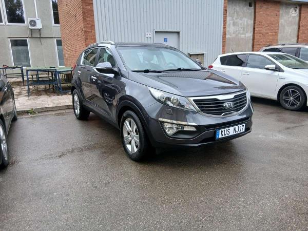 Black Kia Sportage 2013 in Siauliai, with an engine capacity of 1.69 L and mileage of 240 thousand km for 6450 €, photo 1 on AUTOMOTO.COM.LV