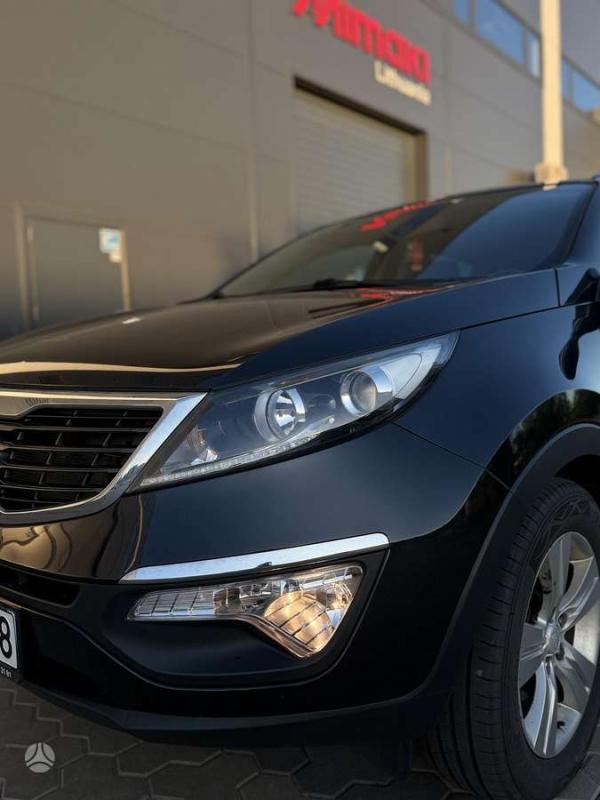 Black Kia Sportage 2014 in Vilnius, with an engine capacity of 2.00 L and mileage of 103 thousand km for 8399 €, photo 6 on AUTOMOTO.COM.LV