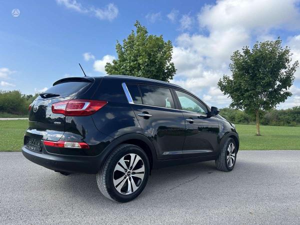 Black Kia Sportage 2014 in Siauliai, with an engine capacity of 1.69 L and mileage of 220 thousand km for 7650 €, photo 5 on AUTOMOTO.COM.LV