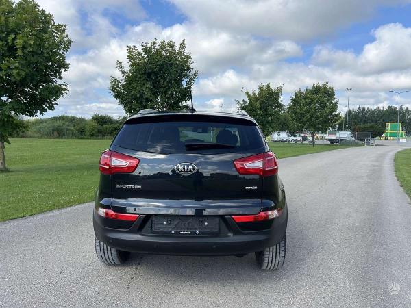 Black Kia Sportage 2014 in Siauliai, with an engine capacity of 1.69 L and mileage of 220 thousand km for 7650 €, photo 6 on AUTOMOTO.COM.LV