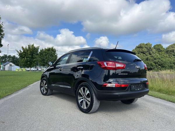 Black Kia Sportage 2014 in Siauliai, with an engine capacity of 1.69 L and mileage of 220 thousand km for 7650 €, photo 7 on AUTOMOTO.COM.LV