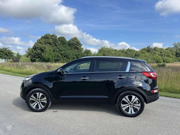 Black Kia Sportage 2014 in Siauliai, with an engine capacity of 1.69 L and mileage of 220 thousand km for 7650 €, photo 8 on AUTOMOTO.COM.LV