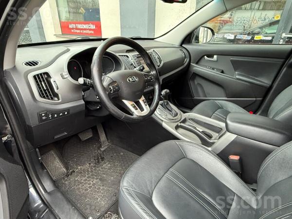 Black Kia Sportage 2015 in Riga, with an engine capacity of 2.00 L and mileage of 177 thousand km for 8950 €, photo 7 on AUTOMOTO.COM.LV
