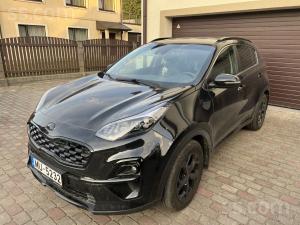 Black Kia Sportage 2021 in Riga, with an engine capacity of 1.60 L and mileage of 23 thousand km for 19500 €, photo  on AUTOMOTO.COM.LV