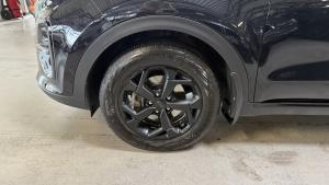Black Kia Sportage 2021 in Riga, with an engine capacity of 1.60 L and mileage of 68 thousand km for 1790000 €, photo 7 on AUTOMOTO.COM.LV