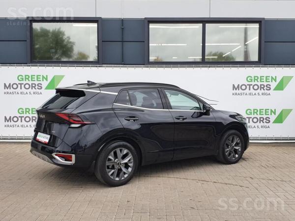 Black Kia Sportage 2022 in Riga, with an engine capacity of 1.60 L and mileage of 82 thousand km for 22900 €, photo 7 on AUTOMOTO.COM.LV