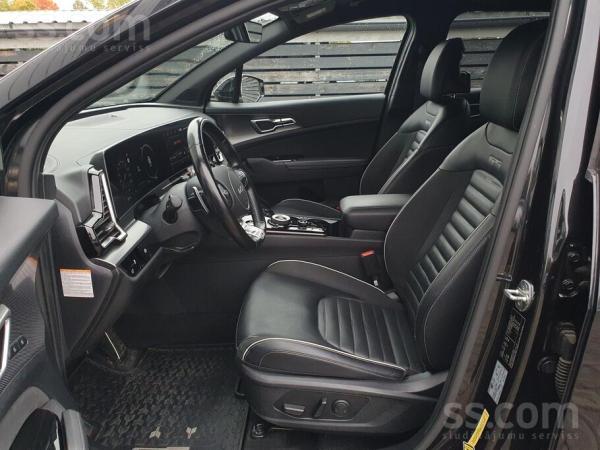 Black Kia Sportage 2022 in Riga, with an engine capacity of 1.60 L and mileage of 82 thousand km for 22900 €, photo 9 on AUTOMOTO.COM.LV