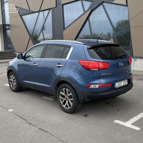 Blue Kia Sportage 2015 in Siauliai, with an engine capacity of 2.00 L and mileage of 260 thousand km for 6999 €, photo 4 on AUTOMOTO.COM.LV