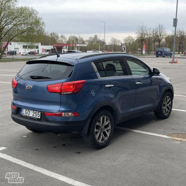 Blue Kia Sportage 2015 in Siauliai, with an engine capacity of 2.00 L and mileage of 260 thousand km for 6999 €, photo 6 on AUTOMOTO.COM.LV
