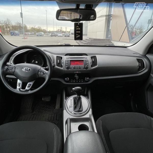 Blue Kia Sportage 2015 in Siauliai, with an engine capacity of 2.00 L and mileage of 260 thousand km for 6999 €, photo 9 on AUTOMOTO.COM.LV