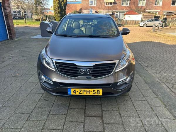 Brown Kia Sportage 2011 in Cesis, with an engine capacity of 2.00 L and mileage of 0 thousand km for 7950 €, photo 2 on AUTOMOTO.COM.LV