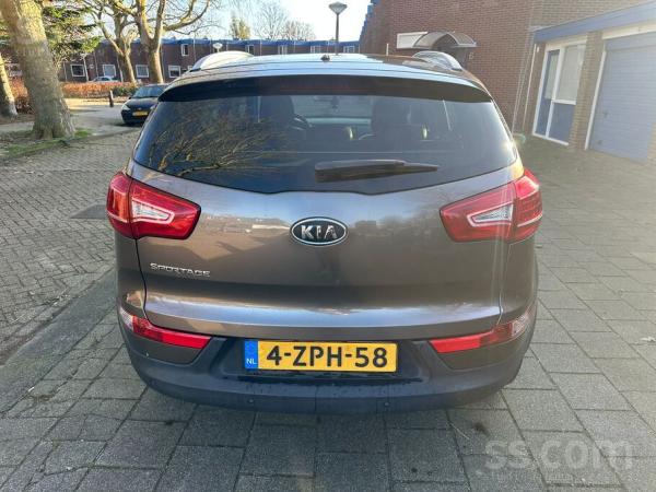Brown Kia Sportage 2011 in Cesis, with an engine capacity of 2.00 L and mileage of 0 thousand km for 7950 €, photo 4 on AUTOMOTO.COM.LV