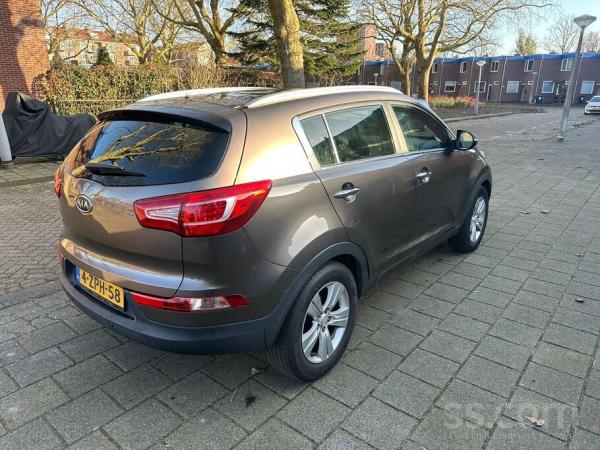 Brown Kia Sportage 2011 in Cesis, with an engine capacity of 2.00 L and mileage of 0 thousand km for 7950 €, photo 5 on AUTOMOTO.COM.LV
