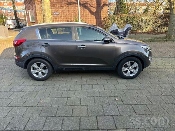 Brown Kia Sportage 2011 in Cesis, with an engine capacity of 2.00 L and mileage of 0 thousand km for 7950 €, photo 6 on AUTOMOTO.COM.LV