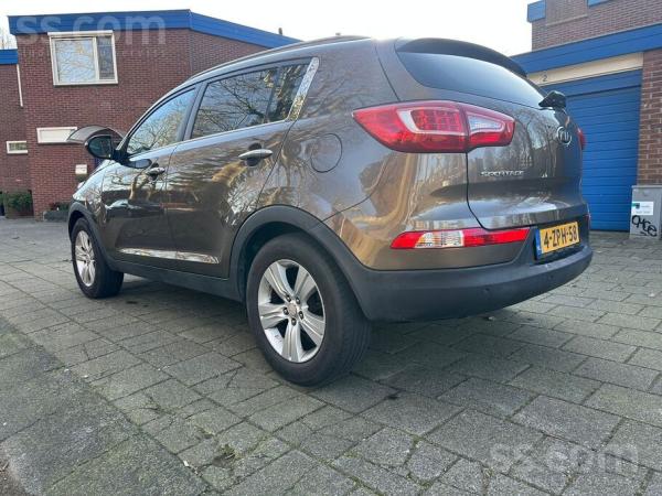 Brown Kia Sportage 2011 in Cesis, with an engine capacity of 2.00 L and mileage of 0 thousand km for 7950 €, photo 7 on AUTOMOTO.COM.LV