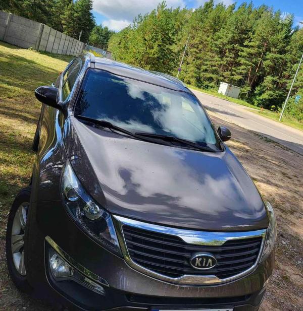 Brown Kia Sportage 2011 in Vilnius, with an engine capacity of 1.69 L and mileage of 245 thousand km for 6200 €, photo 7 on AUTOMOTO.COM.LV