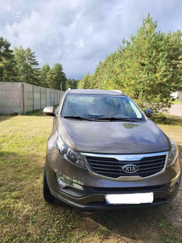 Brown Kia Sportage 2011 in Vilnius, with an engine capacity of 1.69 L and mileage of 245 thousand km for 6200 €, photo 8 on AUTOMOTO.COM.LV