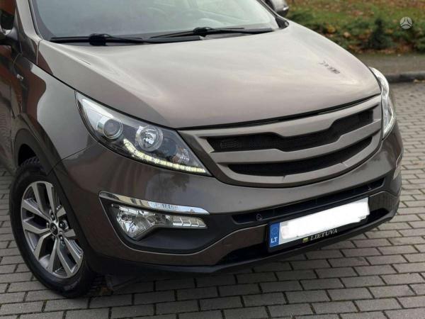 Brown Kia Sportage 2012 in Klaipeda, with an engine capacity of 2.00 L and mileage of 168 thousand km for 7950 €, photo 7 on AUTOMOTO.COM.LV