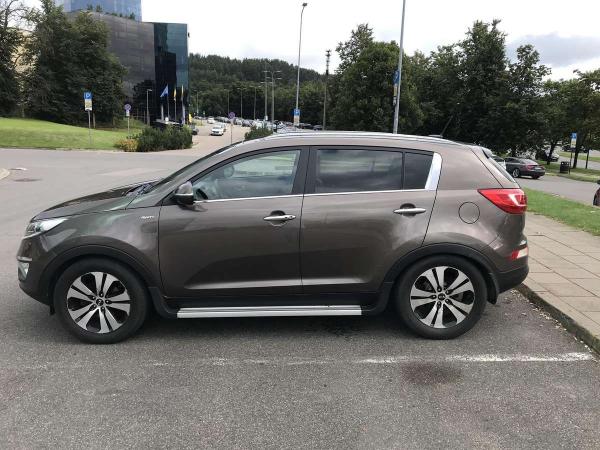 Brown Kia Sportage 2012 in Vilnius, with an engine capacity of 2.00 L and mileage of 190 thousand km for 8300 €, photo 7 on AUTOMOTO.COM.LV