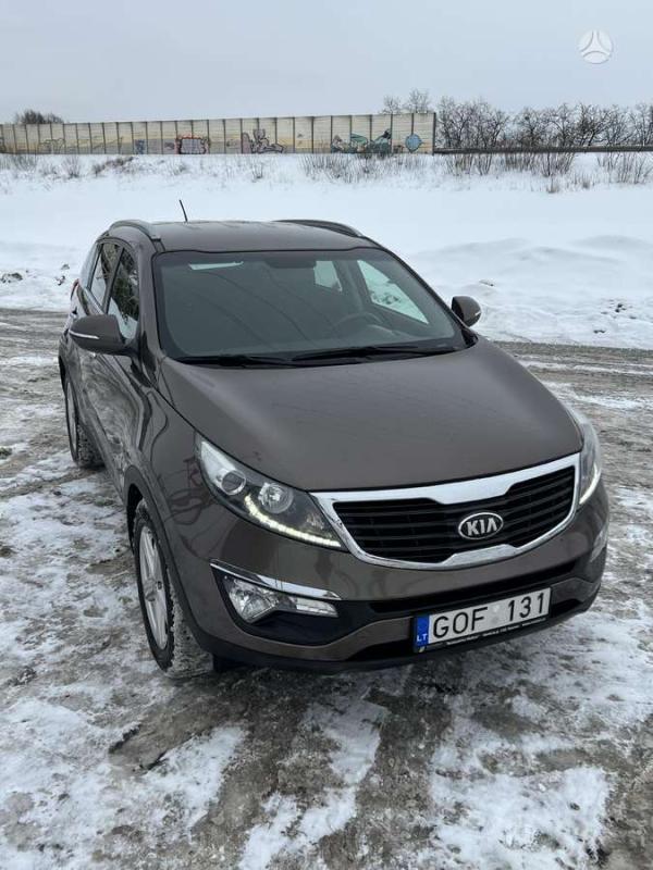 Brown Kia Sportage 2013 in Kaunas, with an engine capacity of 1.69 L and mileage of 206 thousand km for 5400 €, photo 2 on AUTOMOTO.COM.LV