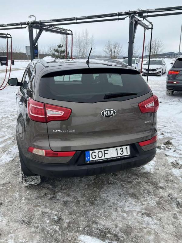 Brown Kia Sportage 2013 in Kaunas, with an engine capacity of 1.69 L and mileage of 206 thousand km for 5400 €, photo 4 on AUTOMOTO.COM.LV
