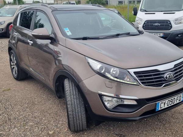 Brown Kia Sportage 2013 in Utena, with an engine capacity of 2.00 L and mileage of 304 thousand km for 6300 €, photo 2 on AUTOMOTO.COM.LV