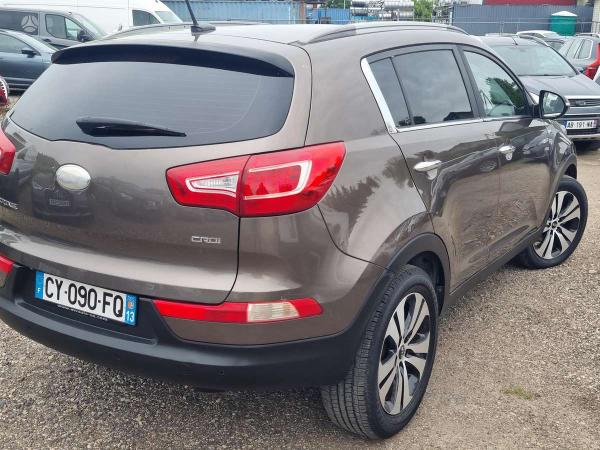 Brown Kia Sportage 2013 in Utena, with an engine capacity of 2.00 L and mileage of 304 thousand km for 6300 €, photo 4 on AUTOMOTO.COM.LV