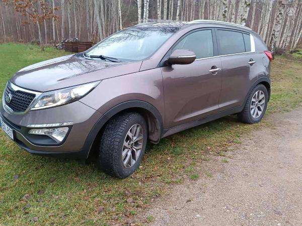 Brown Kia Sportage 2014 in Silute, with an engine capacity of 2.00 L and mileage of 127 thousand km for 8150 €, photo 6 on AUTOMOTO.COM.LV