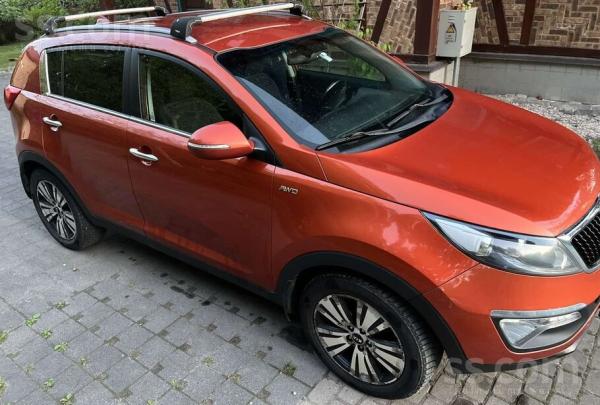 Brown Kia Sportage 2014 in Riga, with an engine capacity of 2.00 L and mileage of 321 thousand km for 6290 €, photo 2 on AUTOMOTO.COM.LV