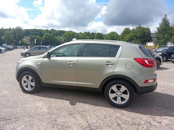 Brown Kia Sportage 2014 in Alytus, with an engine capacity of 1.69 L and mileage of 280 thousand km for 6700 €, photo 2 on AUTOMOTO.COM.LV