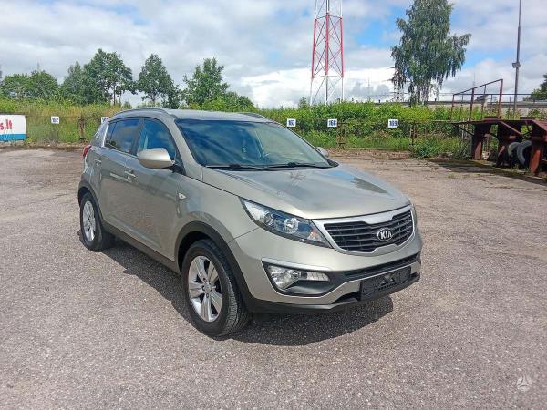 Brown Kia Sportage 2014 in Alytus, with an engine capacity of 1.69 L and mileage of 280 thousand km for 6700 €, photo 3 on AUTOMOTO.COM.LV