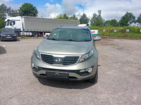 Brown Kia Sportage 2014 in Alytus, with an engine capacity of 1.69 L and mileage of 280 thousand km for 6700 €, photo 4 on AUTOMOTO.COM.LV
