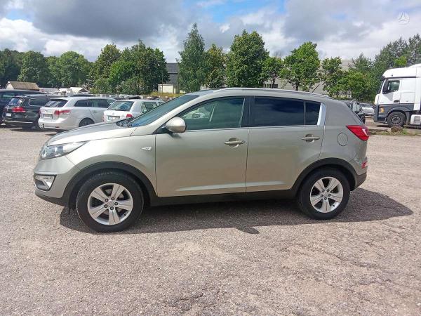 Brown Kia Sportage 2014 in Alytus, with an engine capacity of 1.69 L and mileage of 280 thousand km for 6700 €, photo 6 on AUTOMOTO.COM.LV
