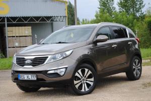 Brown Kia Sportage 2014 in Riga, with an engine capacity of 2.00 L and mileage of 235 thousand km for 7990 €, photo  on AUTOMOTO.COM.LV