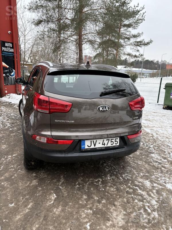 Brown Kia Sportage 2015 in Riga, with an engine capacity of 2.00 L and mileage of 192 thousand km for 8800 €, photo 3 on AUTOMOTO.COM.LV