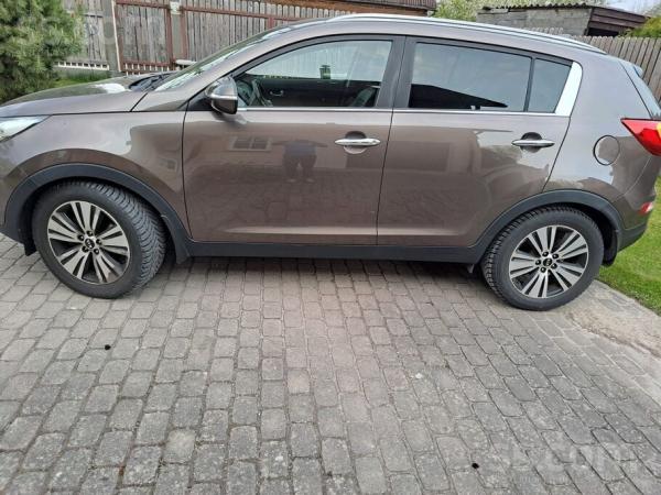 Brūns Kia Sportage 2015 Rīga, ar dzinēja tilpumu 1.70 L un nobraukumu 123 tūkst. km par 9000 €, foto 3 vietnē AUTOMOTO.COM.LV