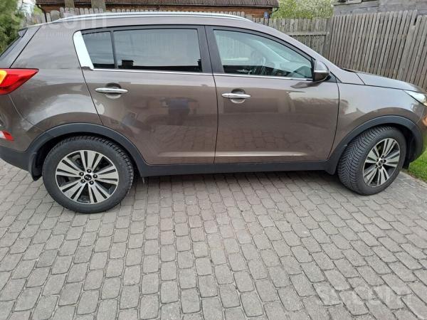 Brūns Kia Sportage 2015 Rīga, ar dzinēja tilpumu 1.70 L un nobraukumu 123 tūkst. km par 9000 €, foto 4 vietnē AUTOMOTO.COM.LV