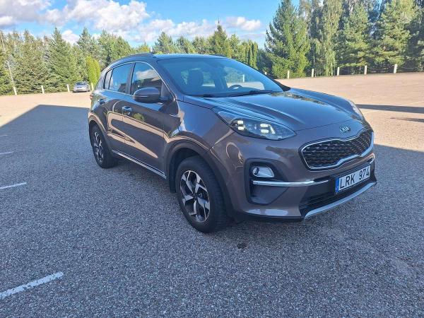 Brūns Kia Sportage 2021 Alīta, ar dzinēja tilpumu 1.59 L un nobraukumu 73 tūkst. km par 19900 €, foto 3 vietnē AUTOMOTO.COM.LV