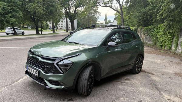 Green Kia Sportage 2022 in Alytus, with an engine capacity of 1.60 L and mileage of 110 thousand km for 24400 €, photo 2 on AUTOMOTO.COM.LV