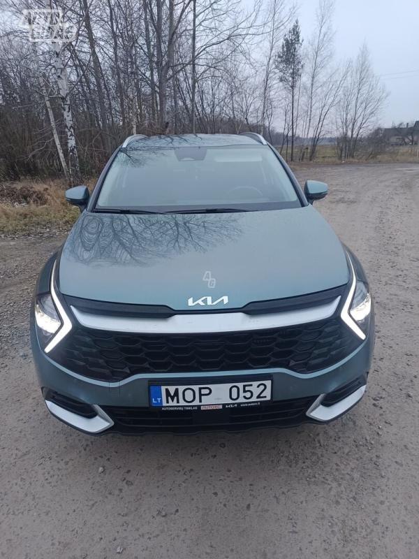 Green Kia Sportage 2023 in Siauliai, with an engine capacity of 1.60 L and mileage of 72 thousand km for 22500 €, photo 3 on AUTOMOTO.COM.LV