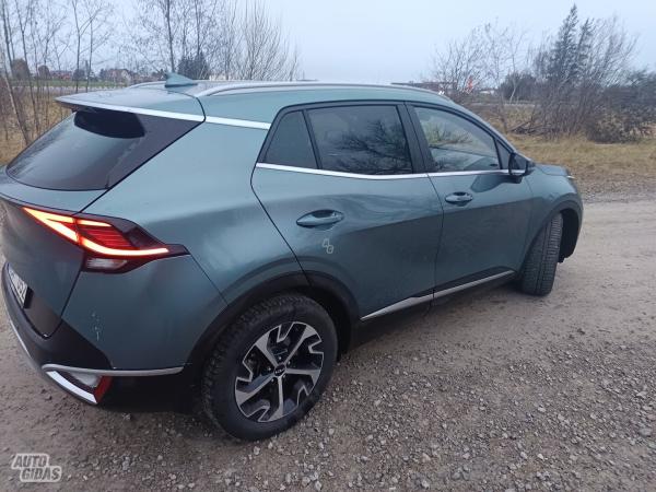 Green Kia Sportage 2023 in Siauliai, with an engine capacity of 1.60 L and mileage of 72 thousand km for 22500 €, photo 5 on AUTOMOTO.COM.LV