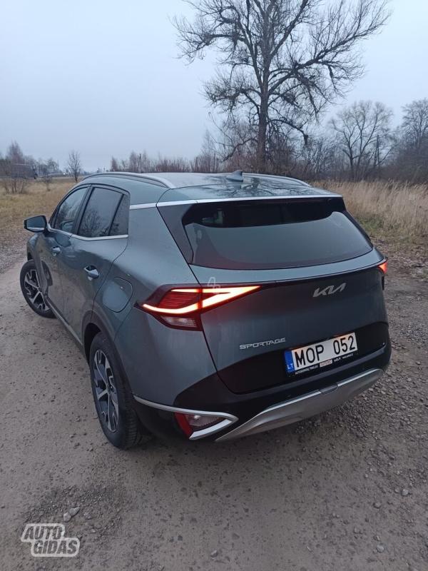 Green Kia Sportage 2023 in Siauliai, with an engine capacity of 1.60 L and mileage of 72 thousand km for 22500 €, photo 7 on AUTOMOTO.COM.LV