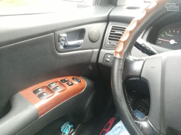 Grey Kia Sportage 2005 in Kaunas, with an engine capacity of 2.00 L and mileage of 219 thousand km for 3400 €, photo 10 on AUTOMOTO.COM.LV